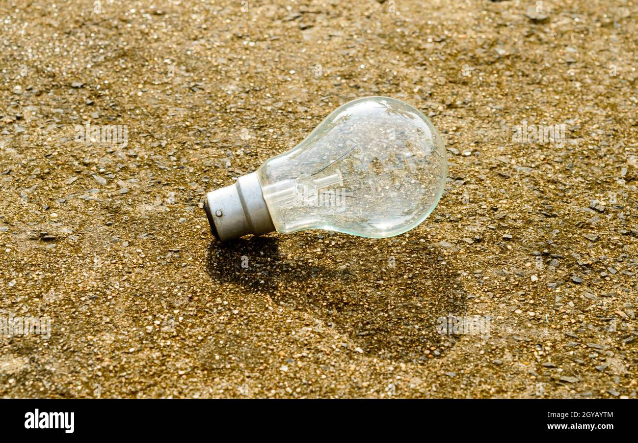 One transparent fluorescent Light bulb in the sunlight with shadow on ...