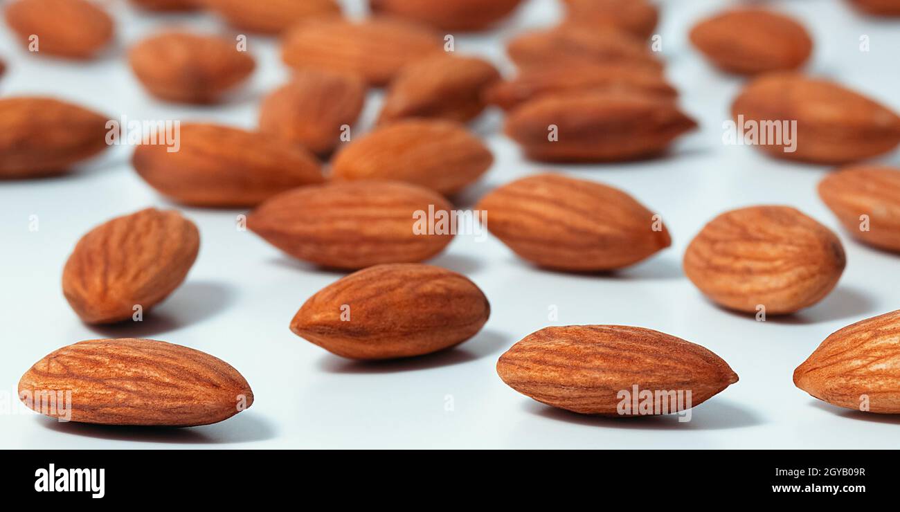 Background of almonds. Fried almonds. Scattered almond grains ...