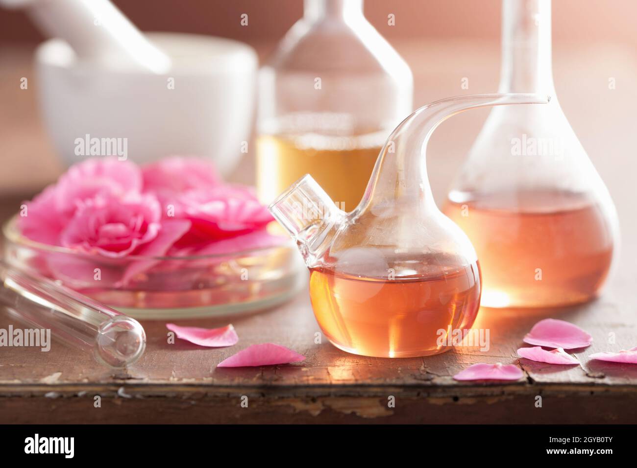 aromatherapy and alchemy with pink flowers Stock Photo - Alamy