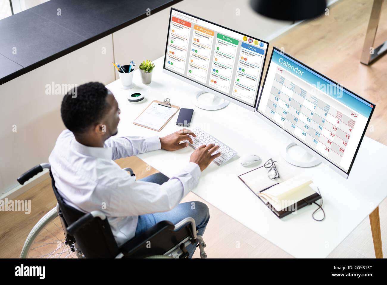 Calendar And Schedule List Chart On Multiple Computer Screens Stock ...