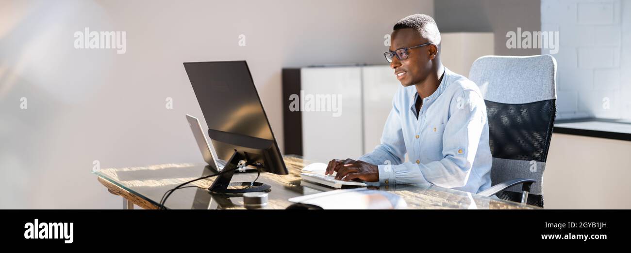 Happy Professional Man Employee Using Computer For Work Stock Photo - Alamy
