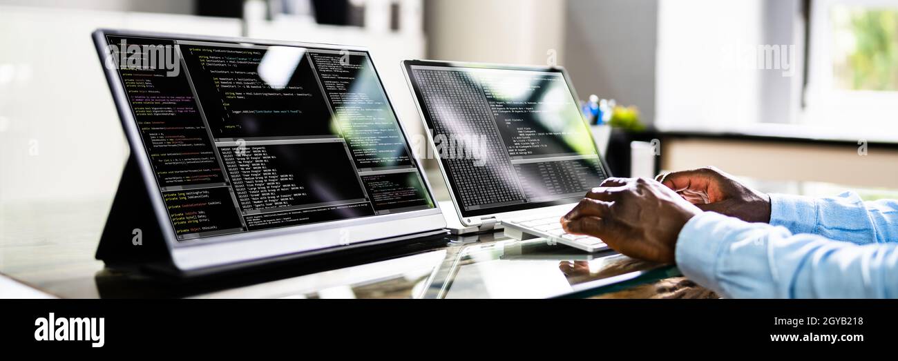 African American Coder Using Computer At Desk. Web Developer Stock Photo - Alamy