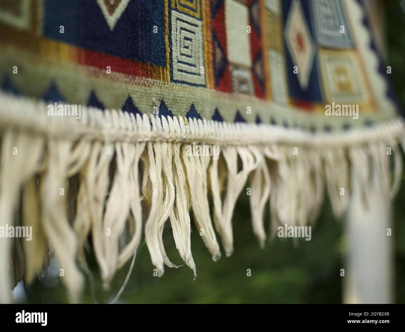 rug with fringe dries after washing close-up Stock Photo - Alamy