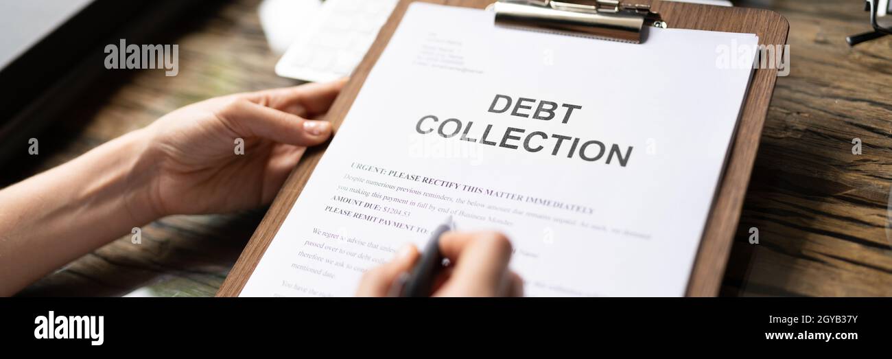 Woman Reading Debt Collection Notice Letter At Desk Stock Photo - Alamy