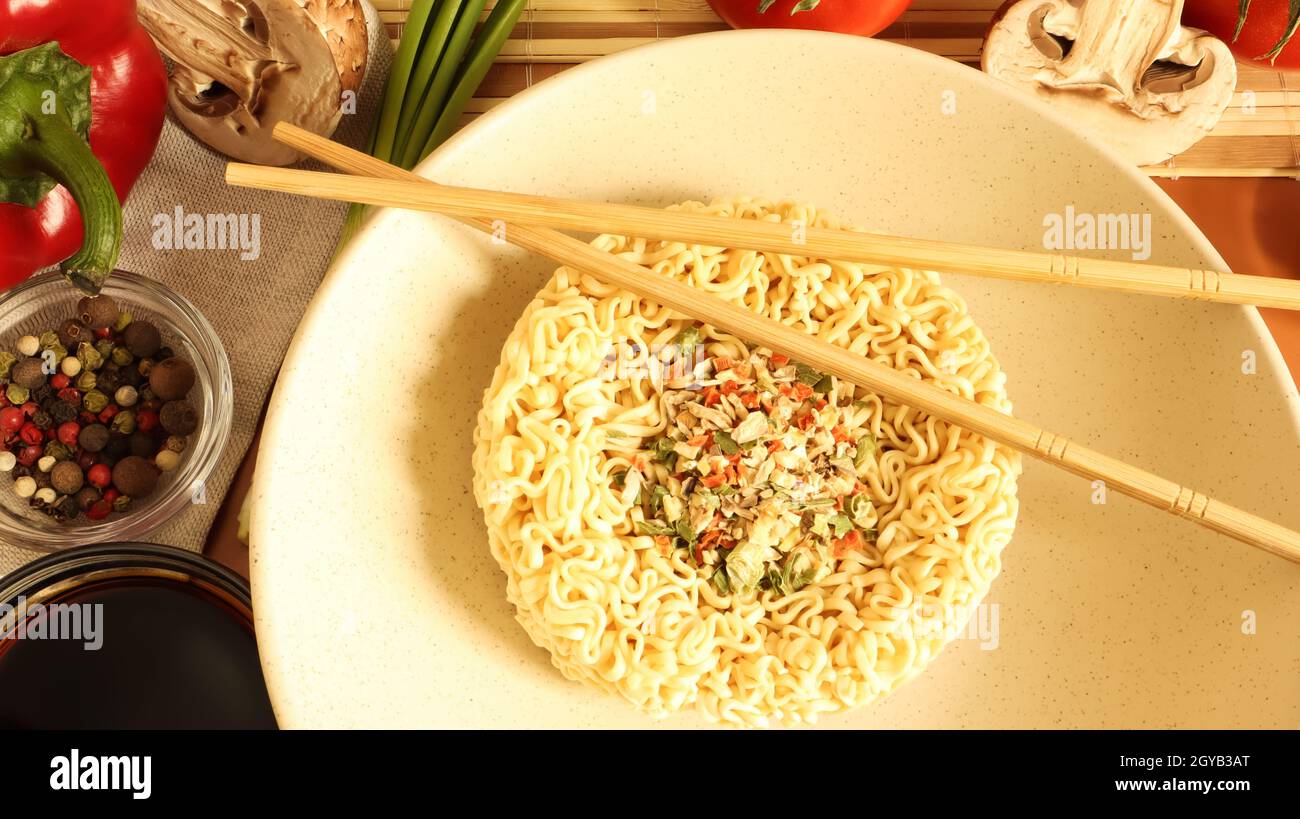 Instant noodles with king mushrooms, seasonings, soy sauce, peppers ...