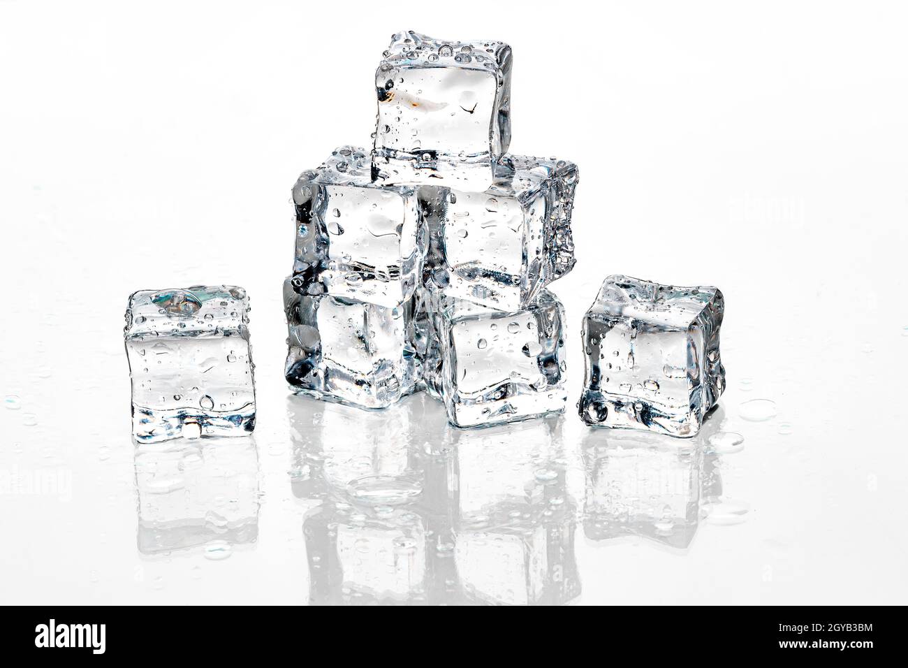 ice cubes on white background Stock Photo - Alamy