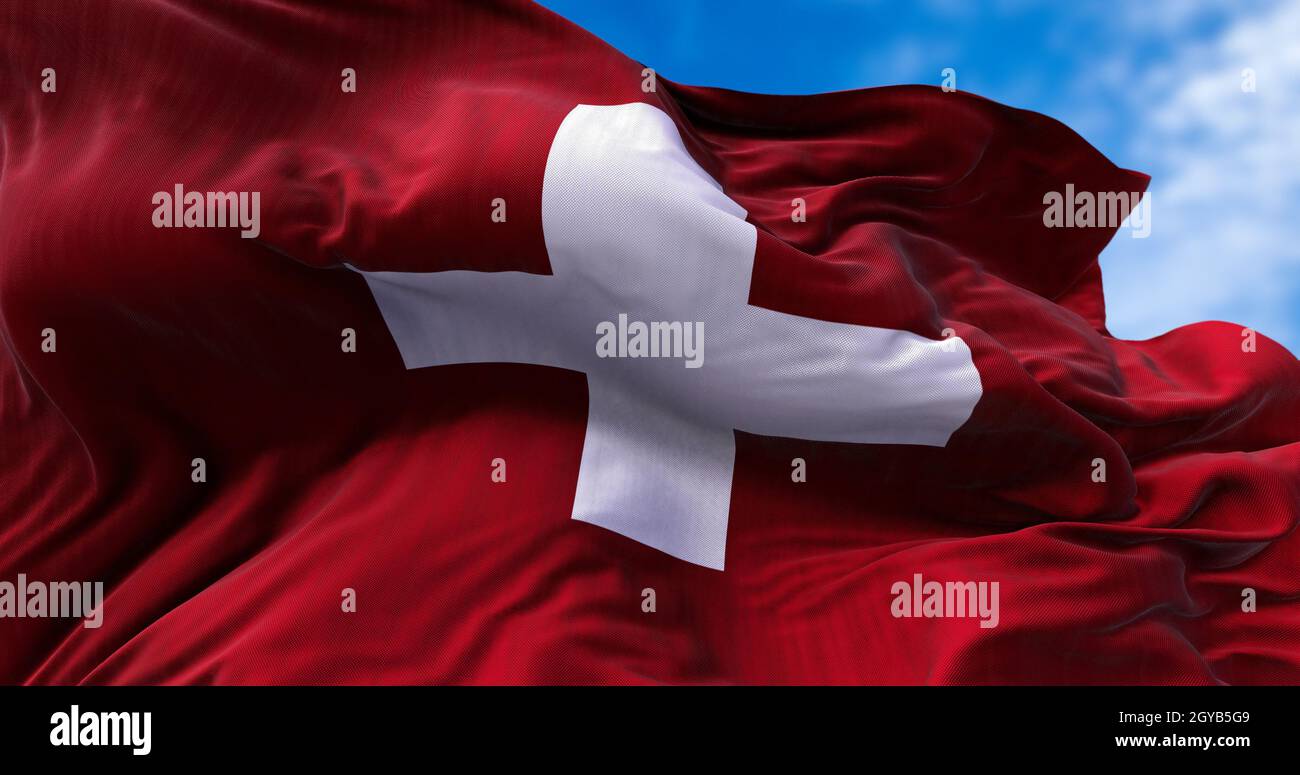 Detail of the national flag of Switzerland flying in the wind ...