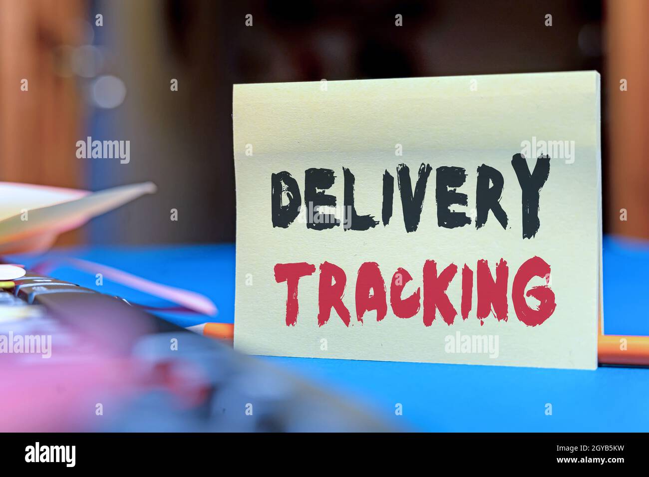 Hand writing sign Delivery Tracking, Word for the process of localizing ...