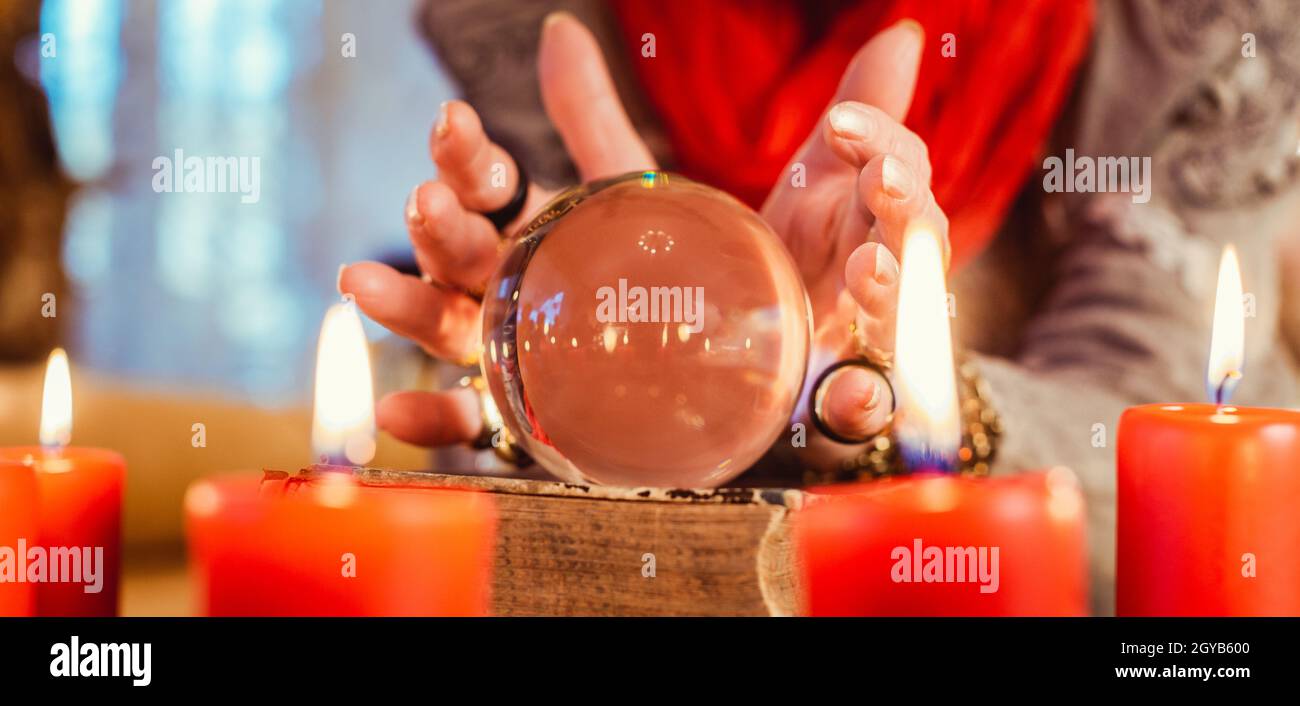 Soothsayer during a Seance or session with Crystal ball Stock Photo - Alamy