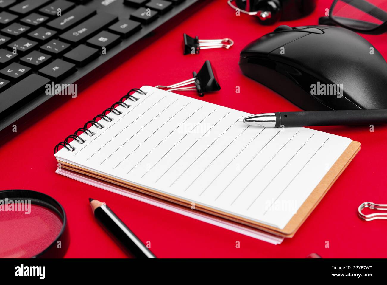 Set of stationery items on red office desk Stock Photo - Alamy