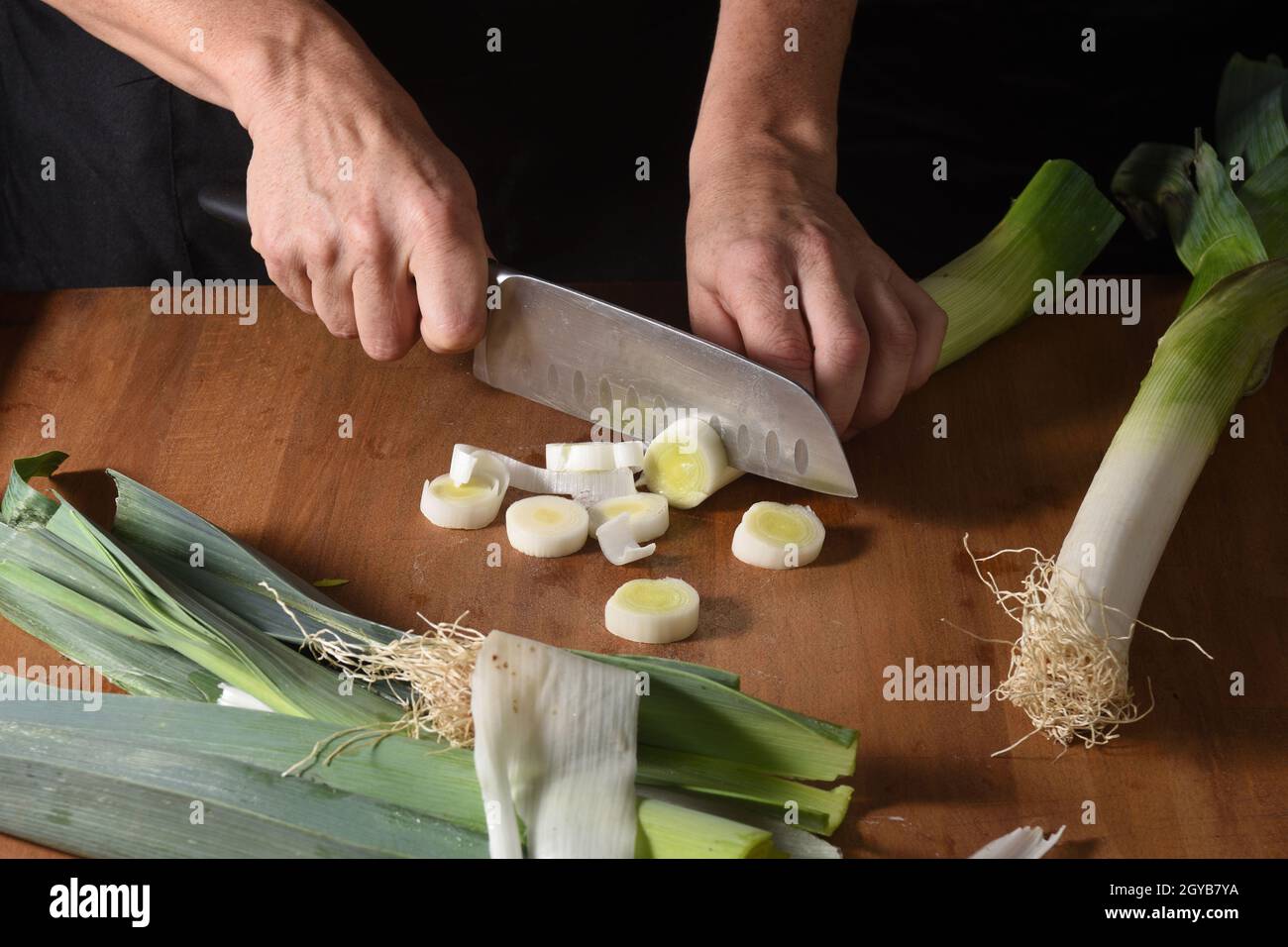 high angle view of a leek cut on wood Stock Photo - Alamy
