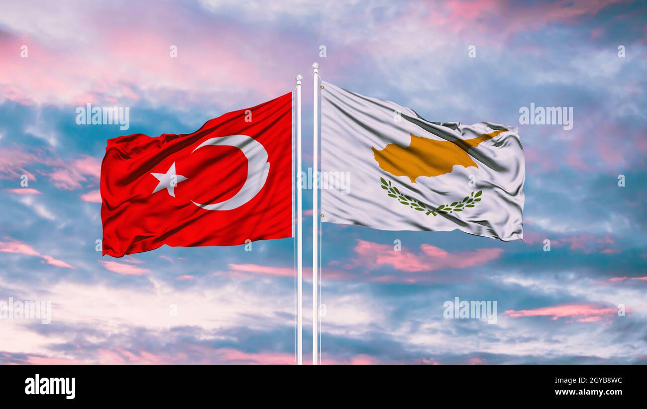 Turkey and Cyprus two flags on flagpoles and blue cloudy sky Stock ...