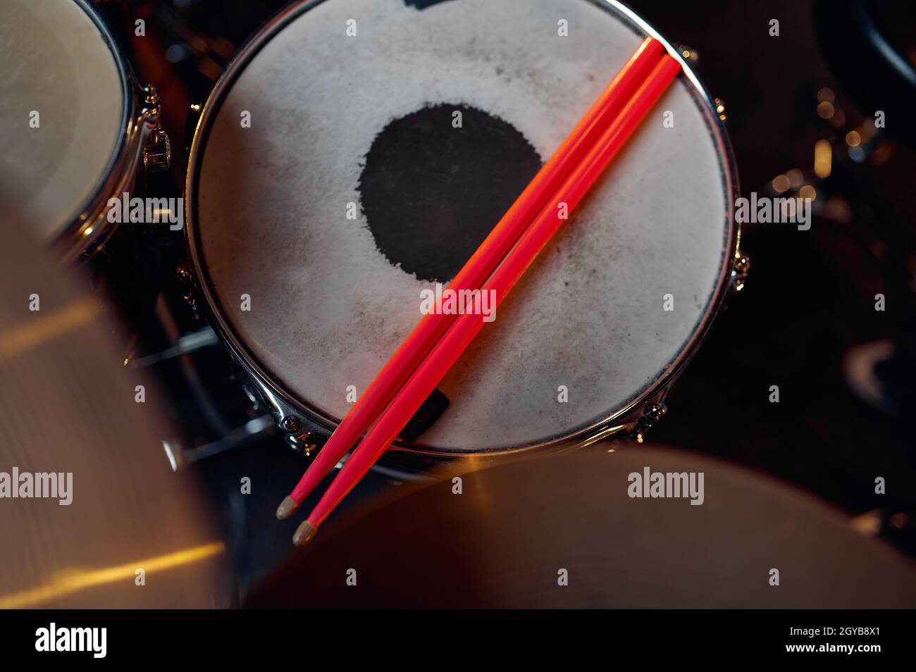 Professional drum kit and sticks closeup, nobody. Rock band concert ...