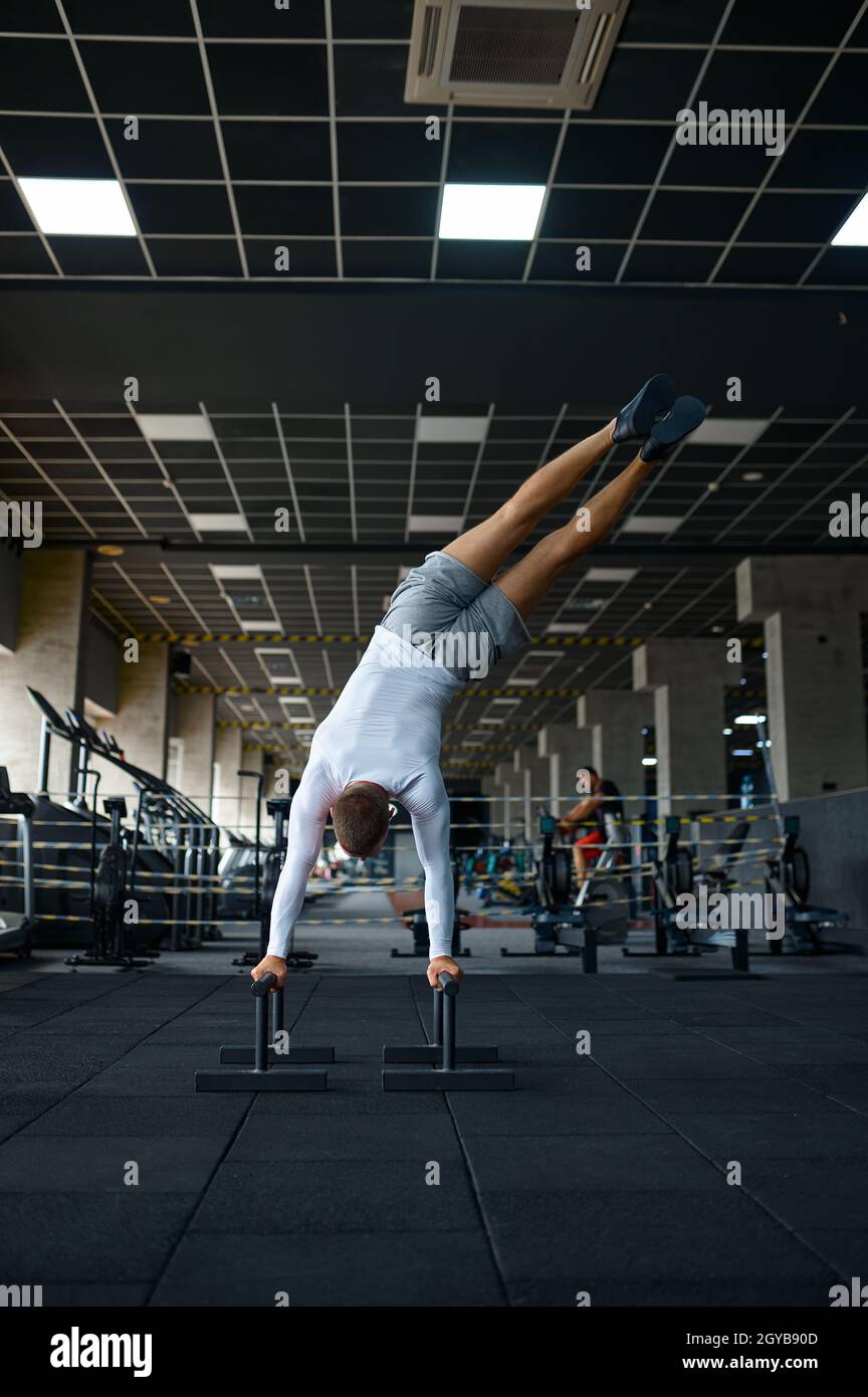 Athletic slim man stretching in hi-res stock photography and images - Alamy