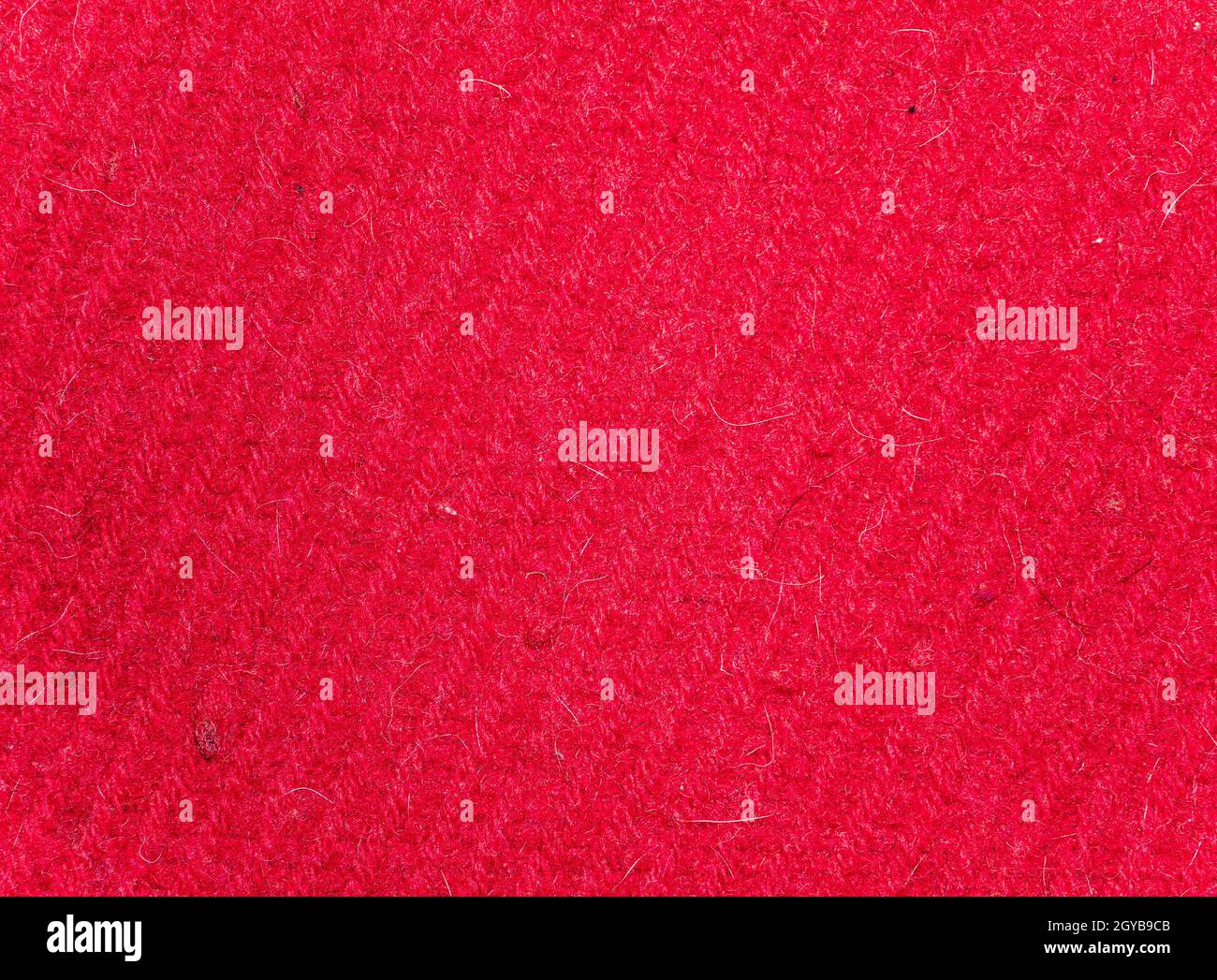 Texture of red woolen knitted fabric. Background image. Place for text ...