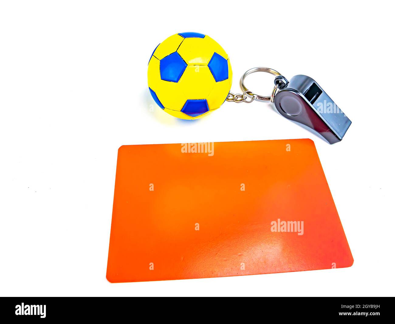 Soccer ball and referee whistle with cards on a white background. Sport ...