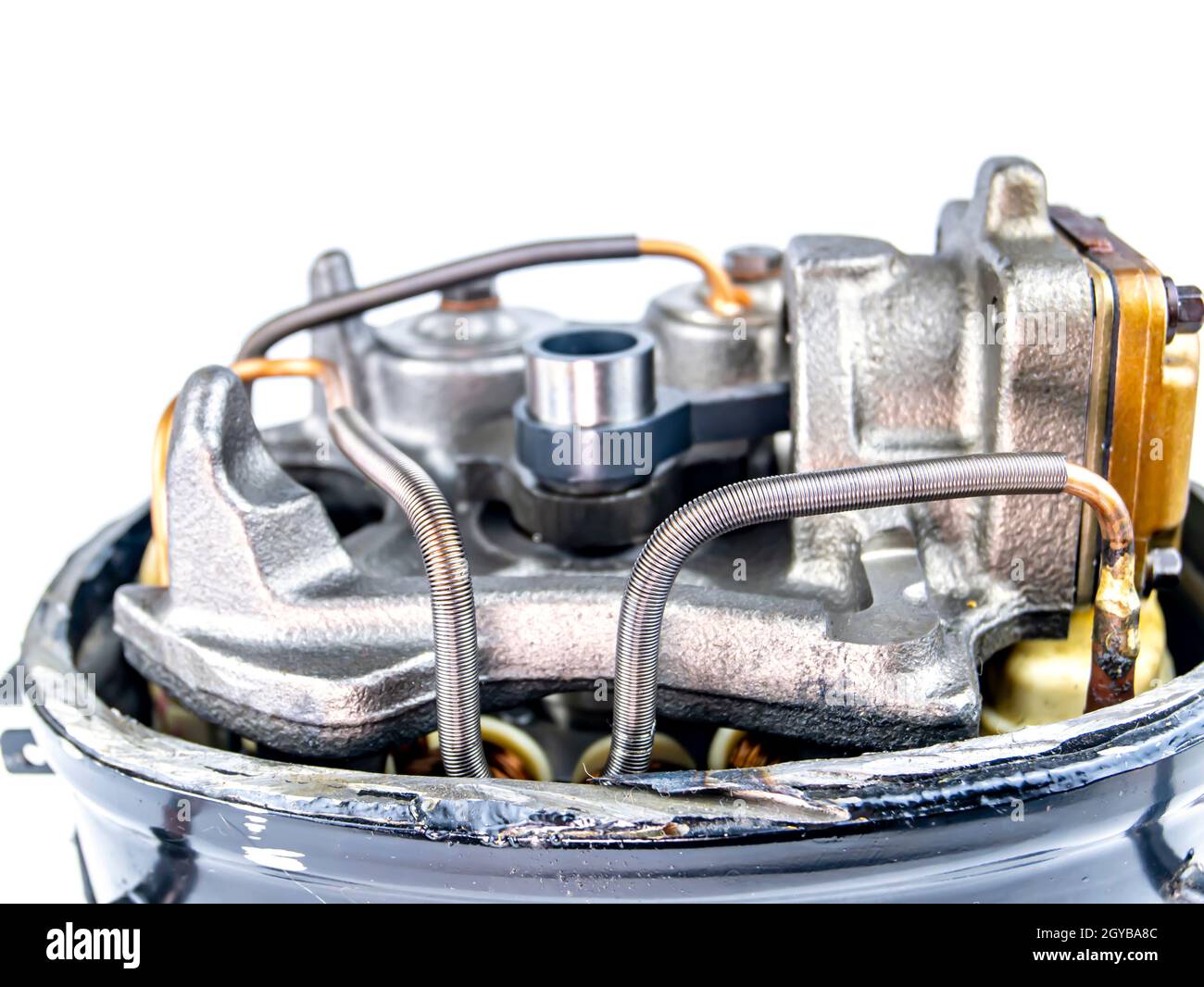 Compressor for repairing refrigerators on a white background. Repair of ...