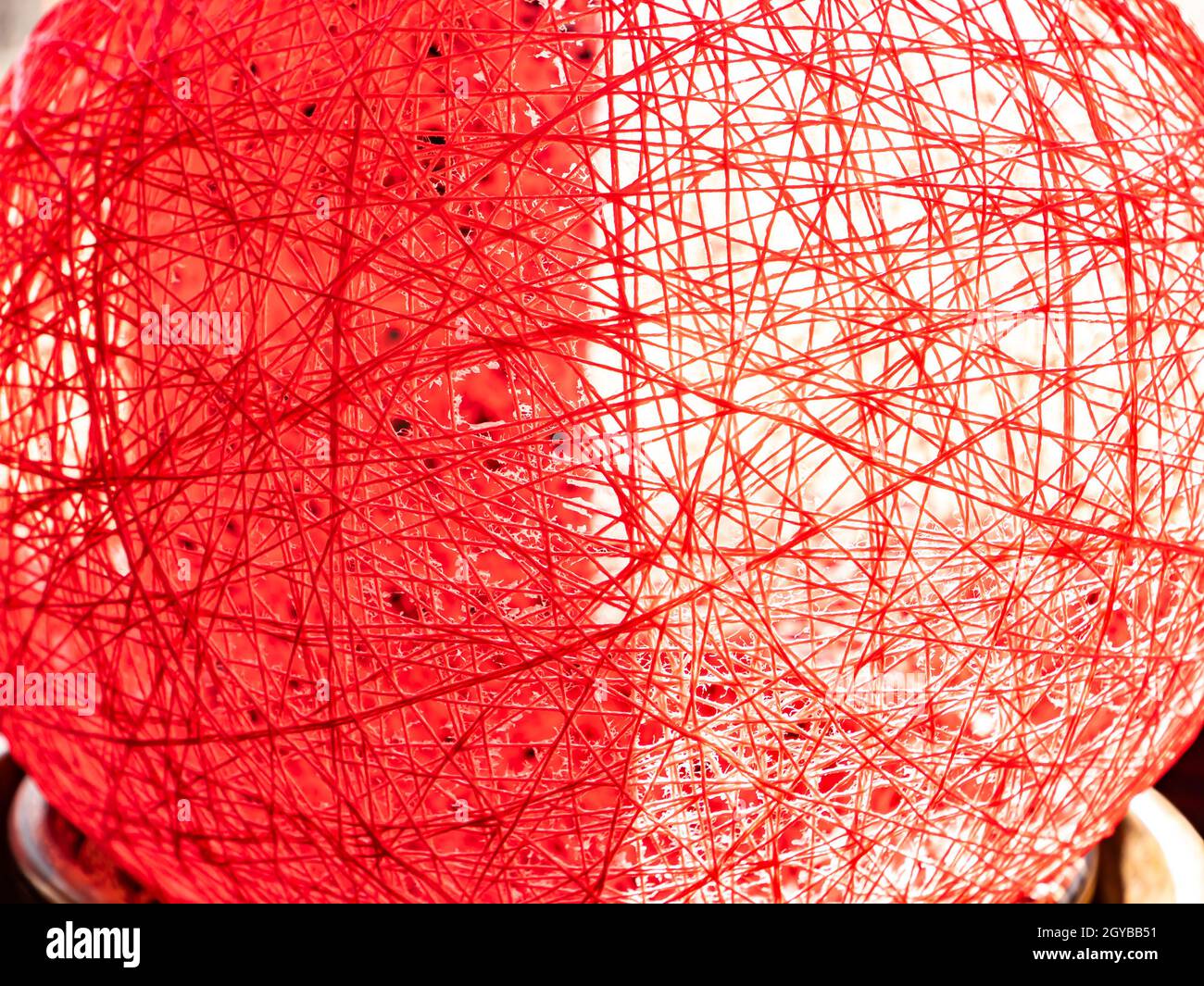 Red thread texture in sunlight from the window. Abstraction. Place for ...
