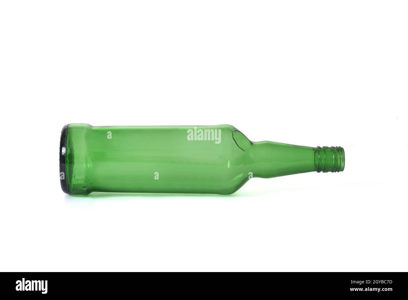 green glass bottle of whisky lying on white background Stock Photo - Alamy