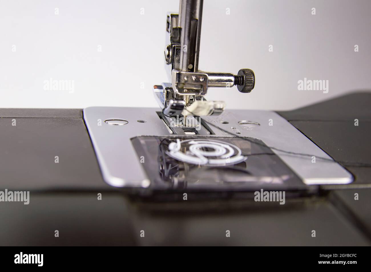 Modern electric sewing machine on a white background. Place for text ...