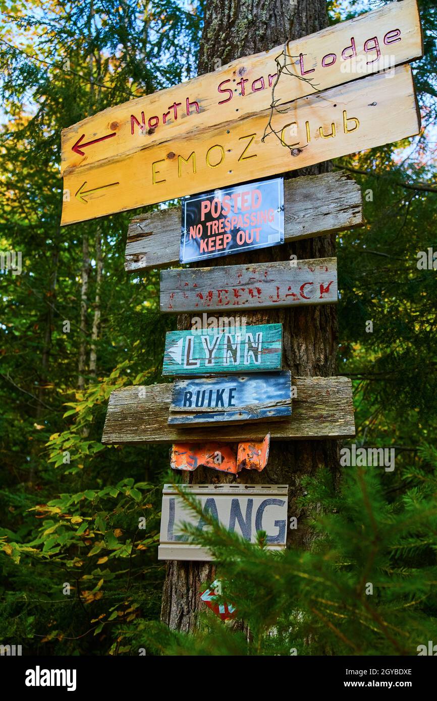 Old signs in a forest pointing to different locations including a keep ...