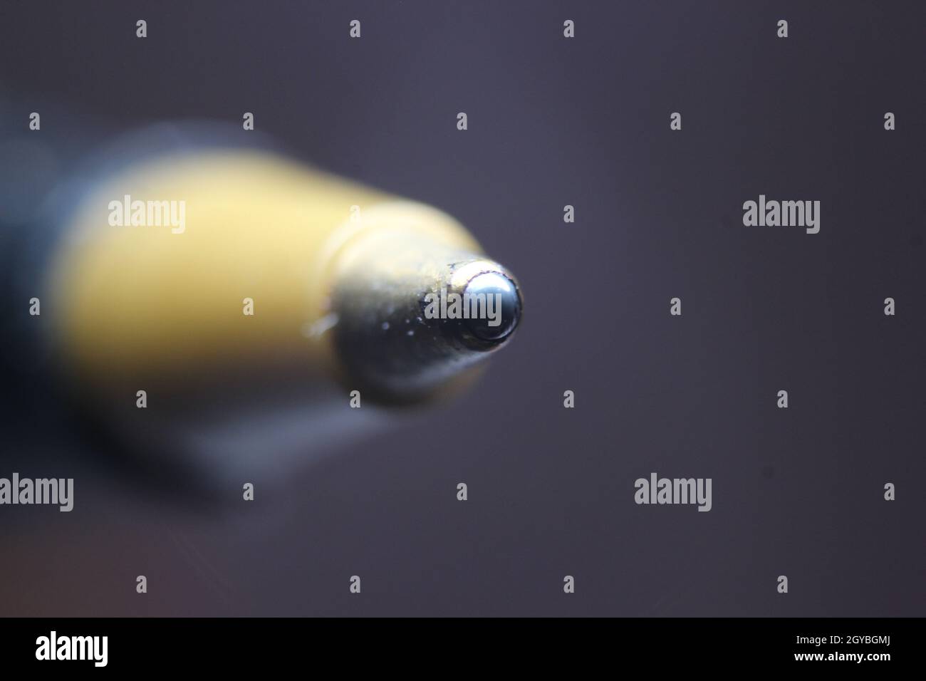 Macro photo of ballpoint pen tip with dark grey background. Extreme ...