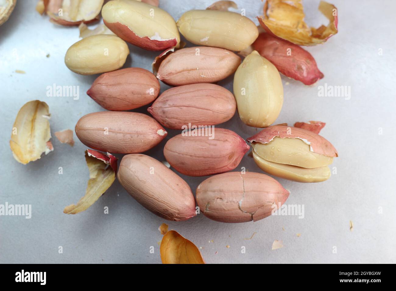 Peeled peanut with shells. Food background of peanuts Stock Photo - Alamy