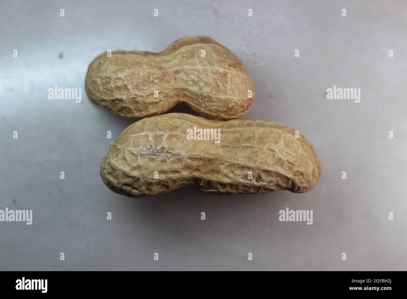 Unpeeled peanut with shells. Food background of peanuts Stock Photo - Alamy