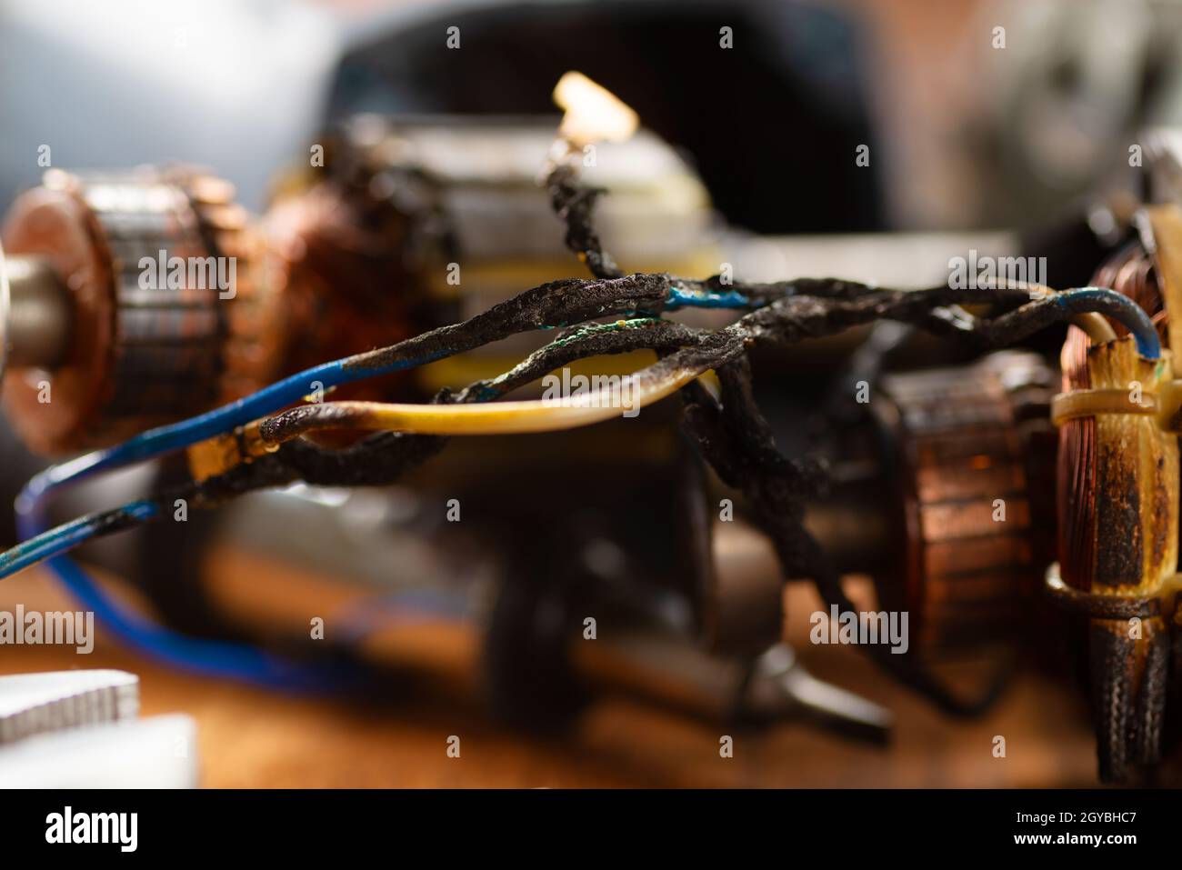 Burnt wires on the parts of an electrical appliance, drills on a wooden ...