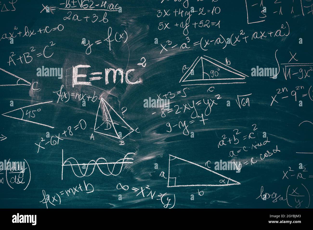 Blackboard inscribed with scientific formulas and calculations in ...