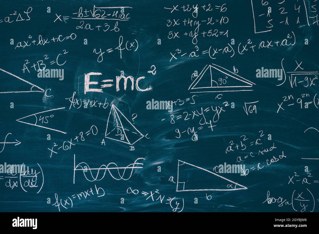 Blackboard inscribed with scientific formulas and calculations in ...