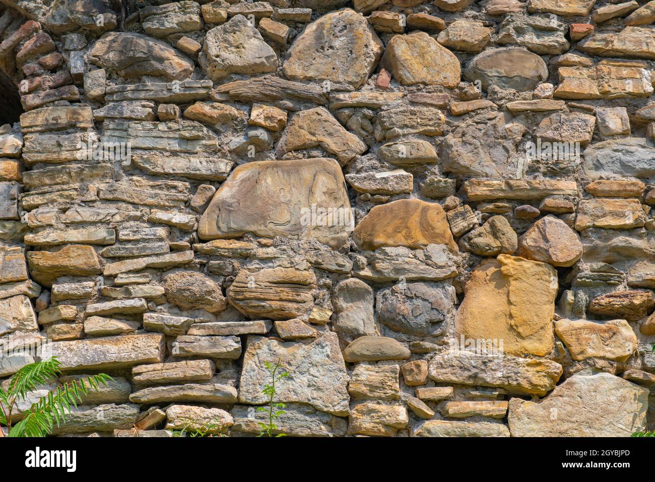 a wall of different stones is beautiful Stock Photo - Alamy