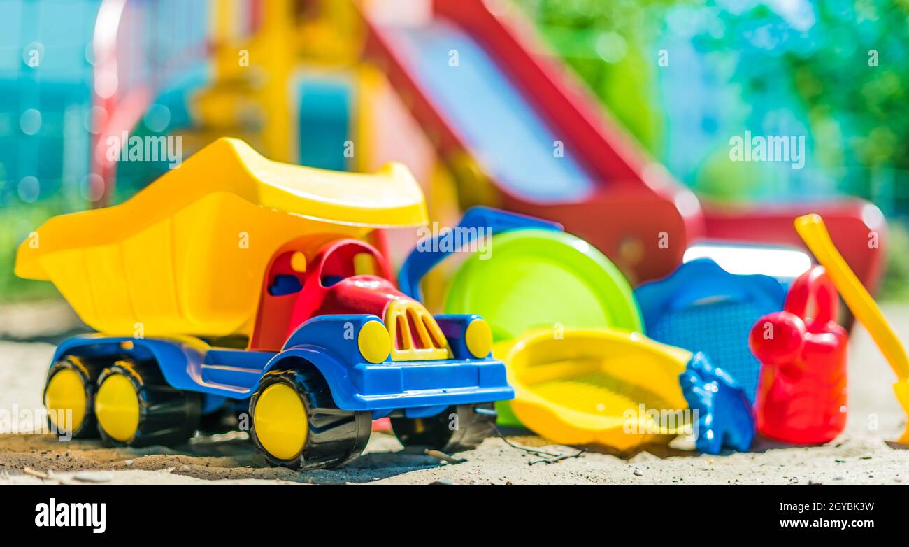 Colorful plastic children toys on the playground Stock Photo - Alamy