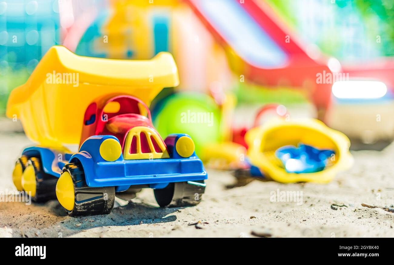 Colorful plastic children toys on the playground Stock Photo - Alamy