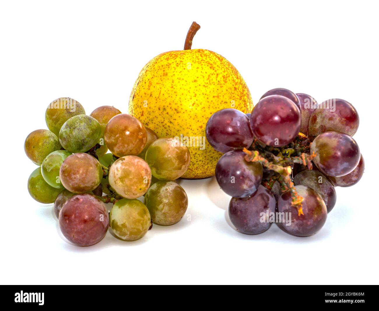 Harvest grapes berries on pears fruits white background. Grape juice ...