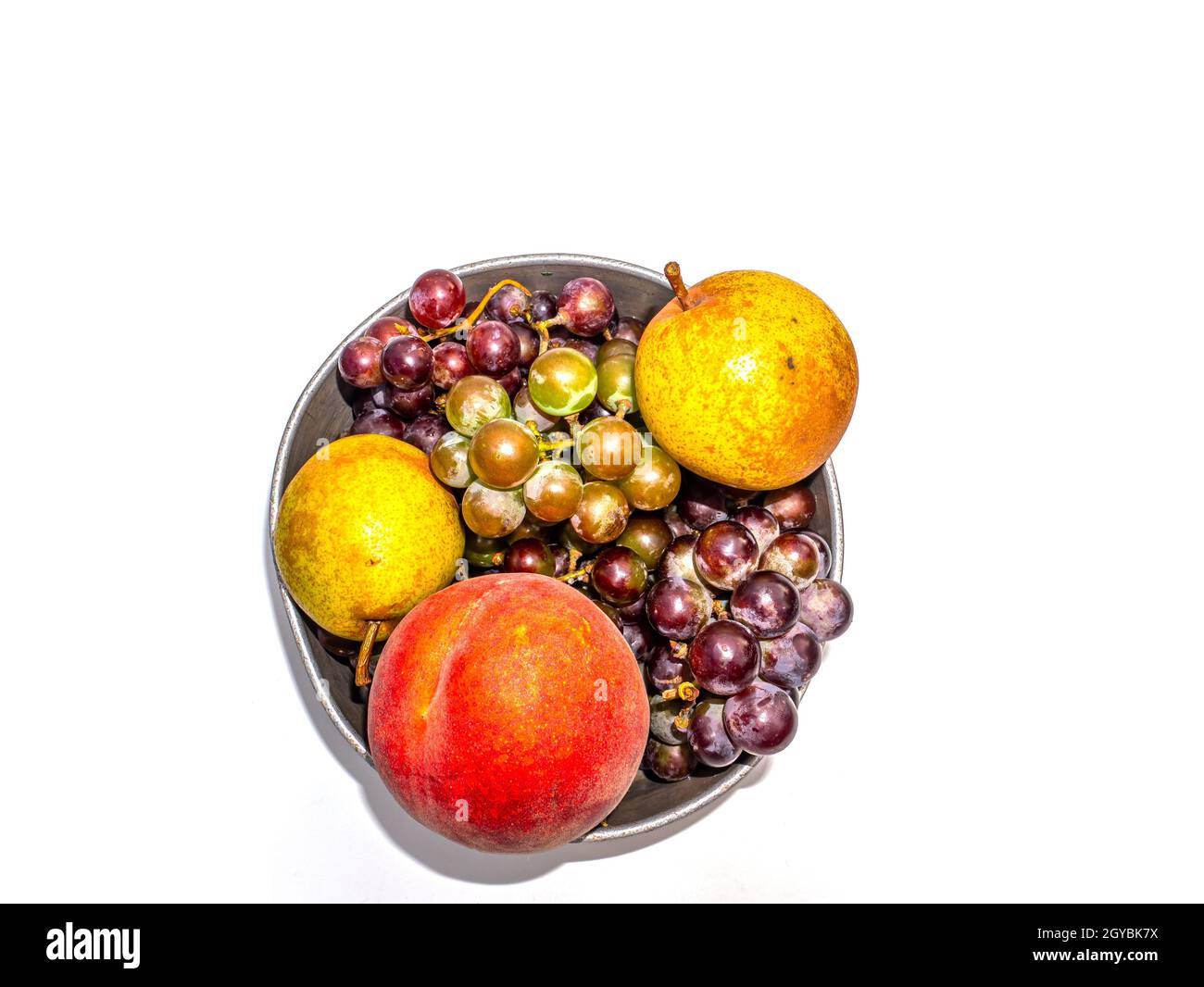 Peach fruit harvest with pear and grapes on a white background. Red ...