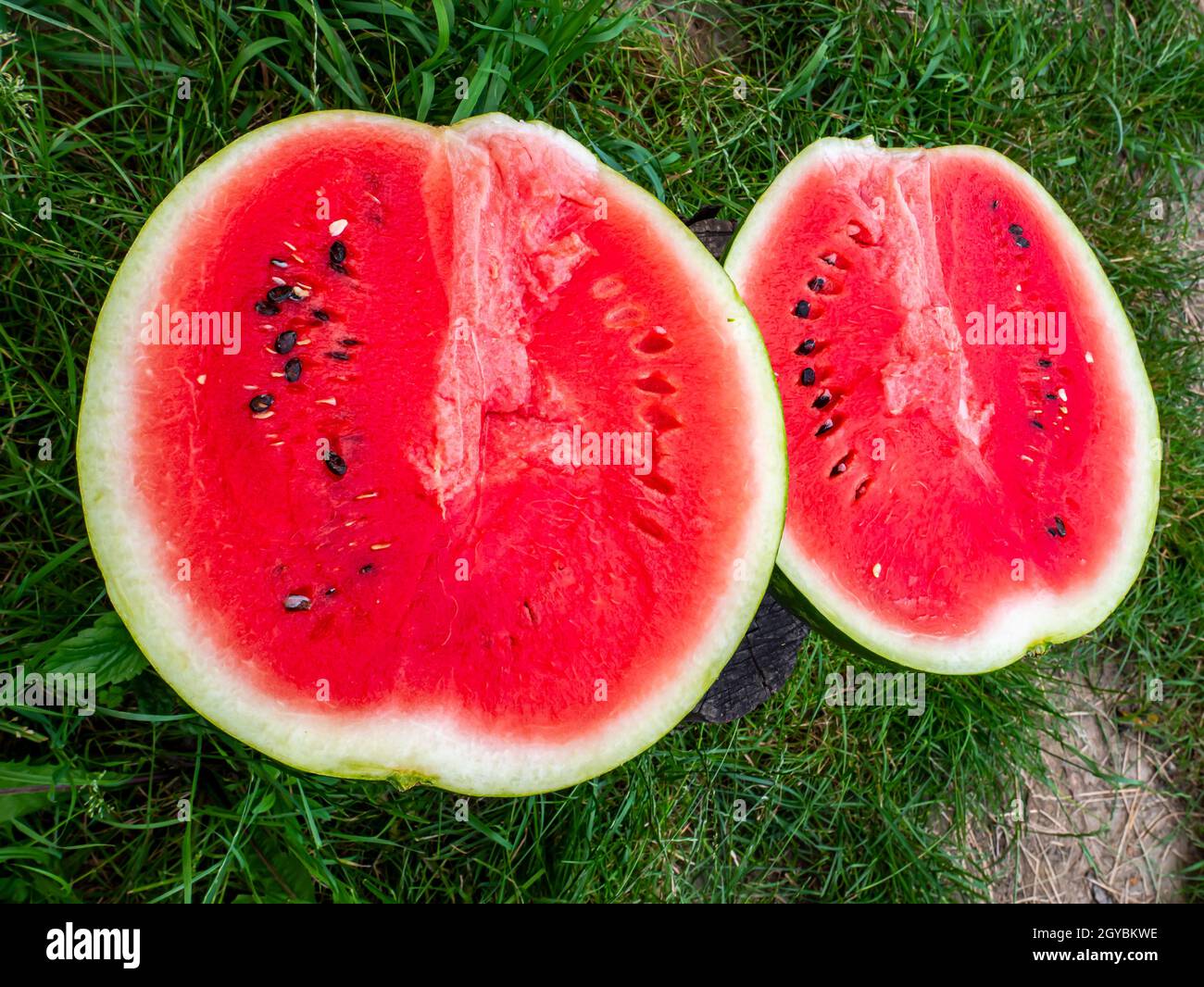 Red watermelon with seeds cut with a knife. Berry. Food photo. Place ...