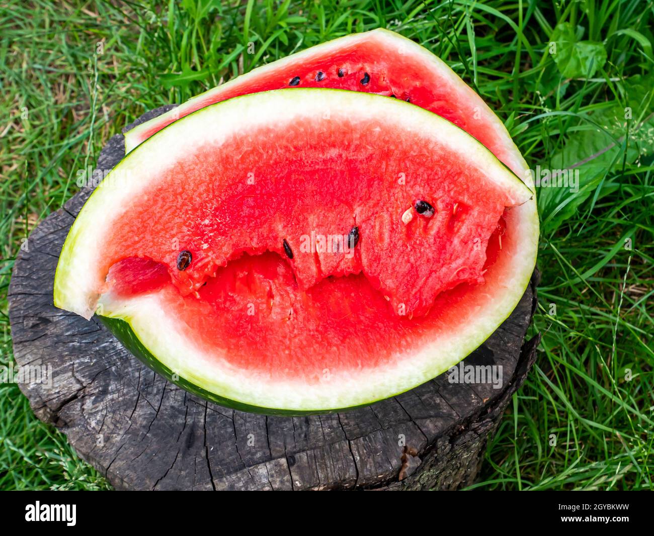 Red watermelon with seeds cut with a knife. Berry. Food photo. Place ...