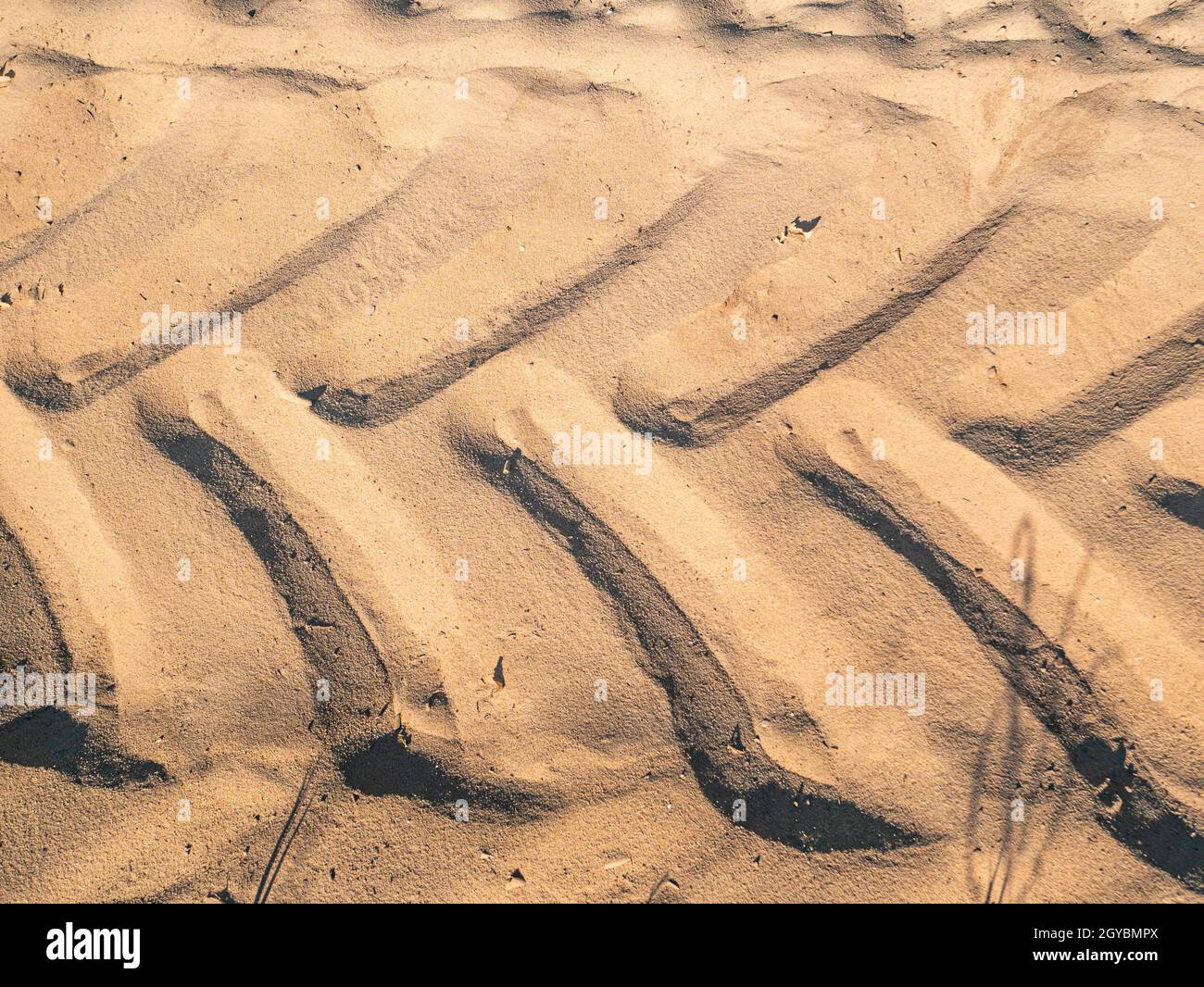 Car wheel tread trace on the sand. Freight road transport. Ride an all ...