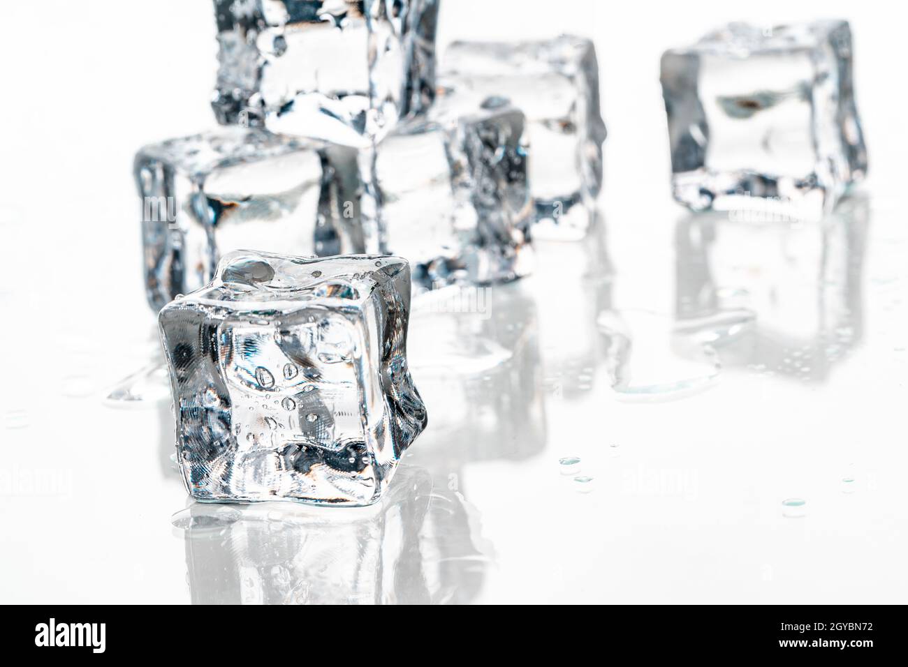 ice cubes on white background Stock Photo - Alamy