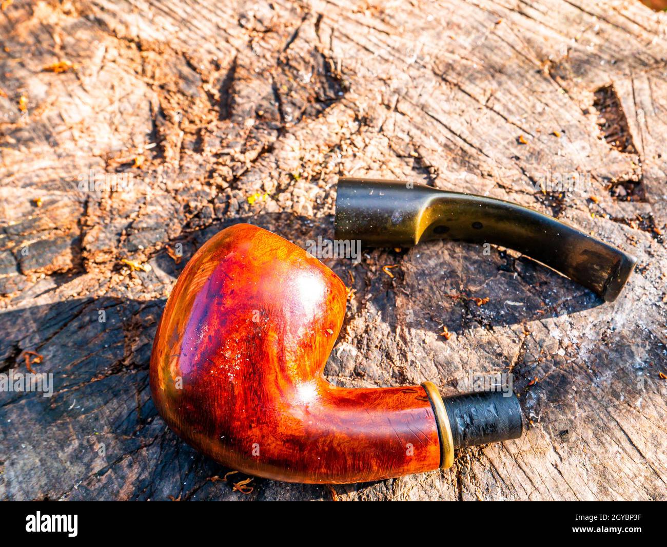 Disassembled smoking pipe for tobacco on a wooden table. Wooden pipe ...