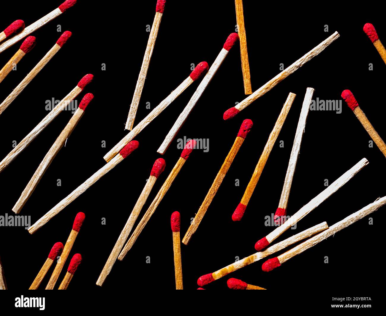 Wooden matches with red sulfur heads on a black background. Fire ...
