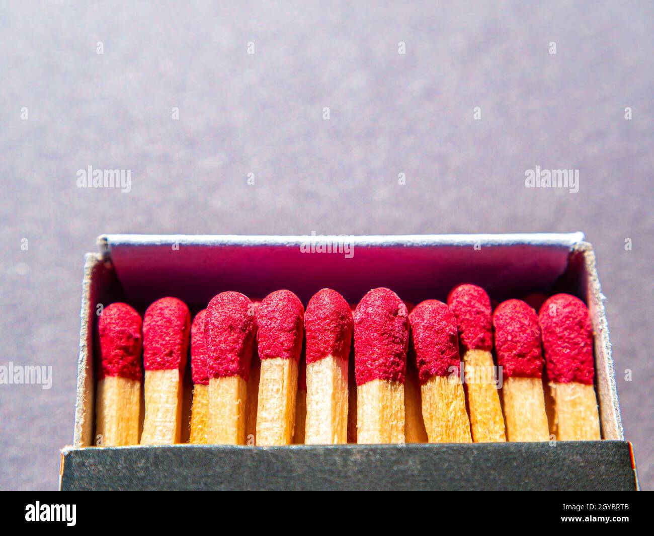 Cardboard box of wooden matches with red sulfur heads. Fire ignition ...