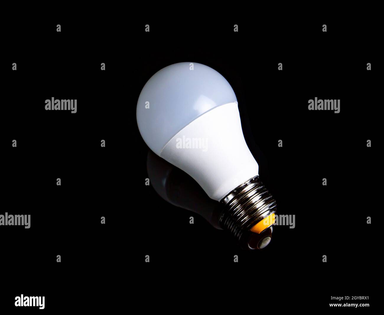 White LED lamp on a black background. White LED lamp. Black background ...