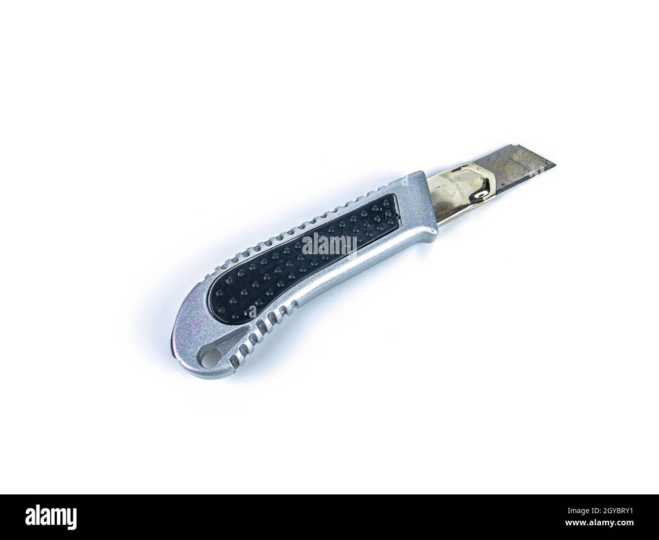 Construction knife with a metal blade on a white background ...