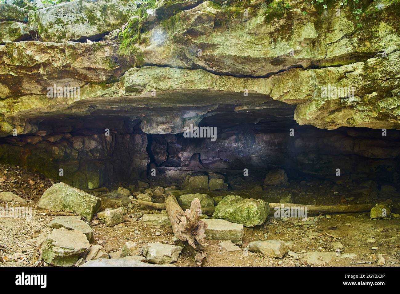 Mossy cave with an eerie light Stock Photo - Alamy