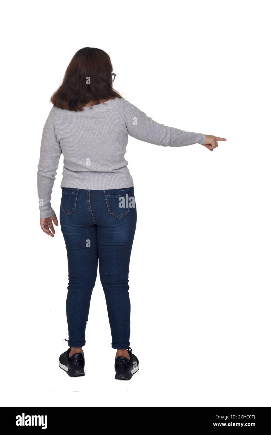 Portrait brunette woman pointing behind hi-res stock photography and ...