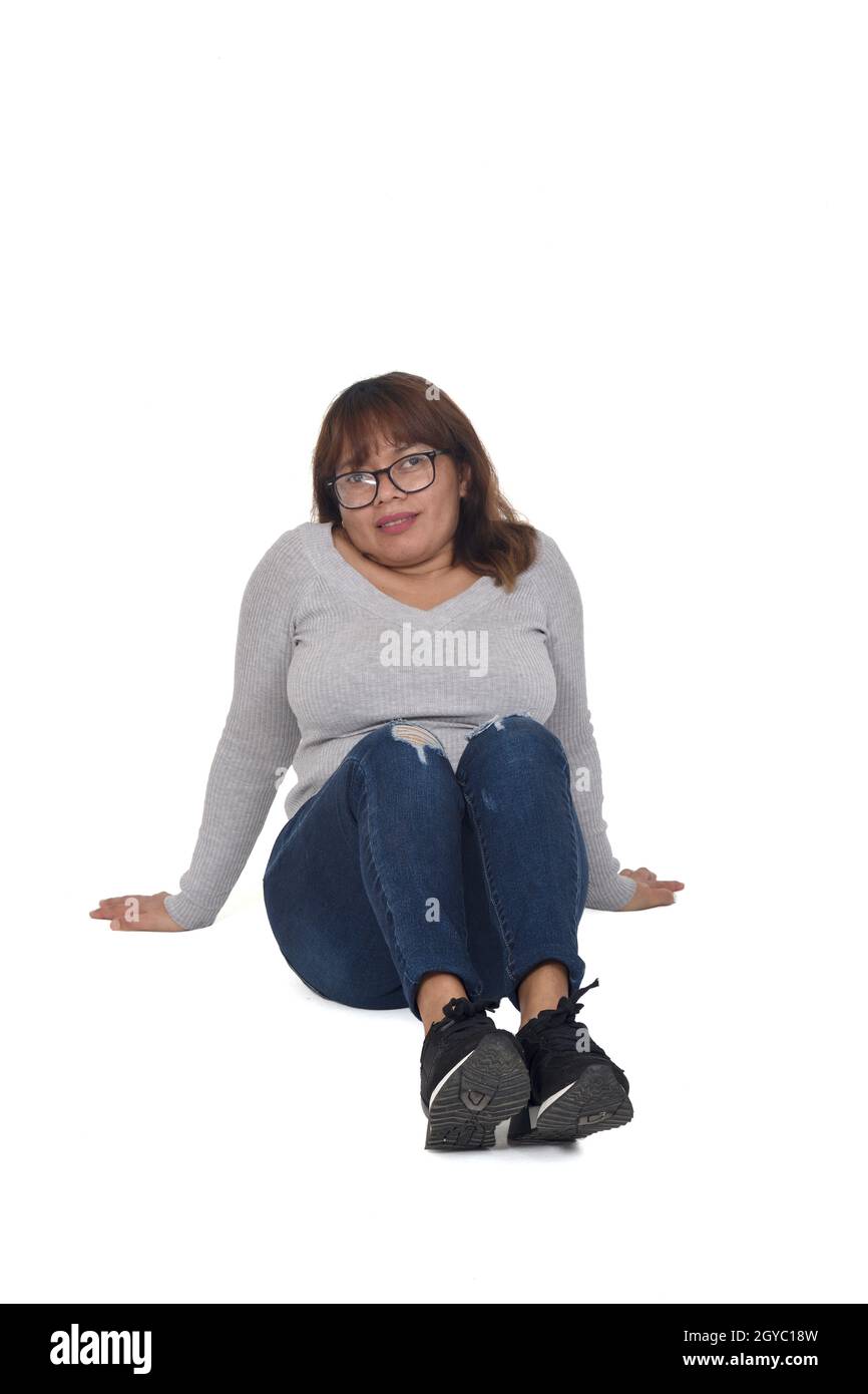 front view of woman sitting on the floor on white background Stock ...