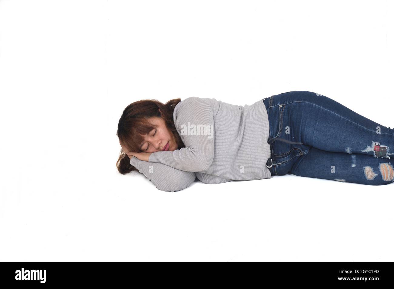 front view of a woman lying on the on white background Stock Photo - Alamy