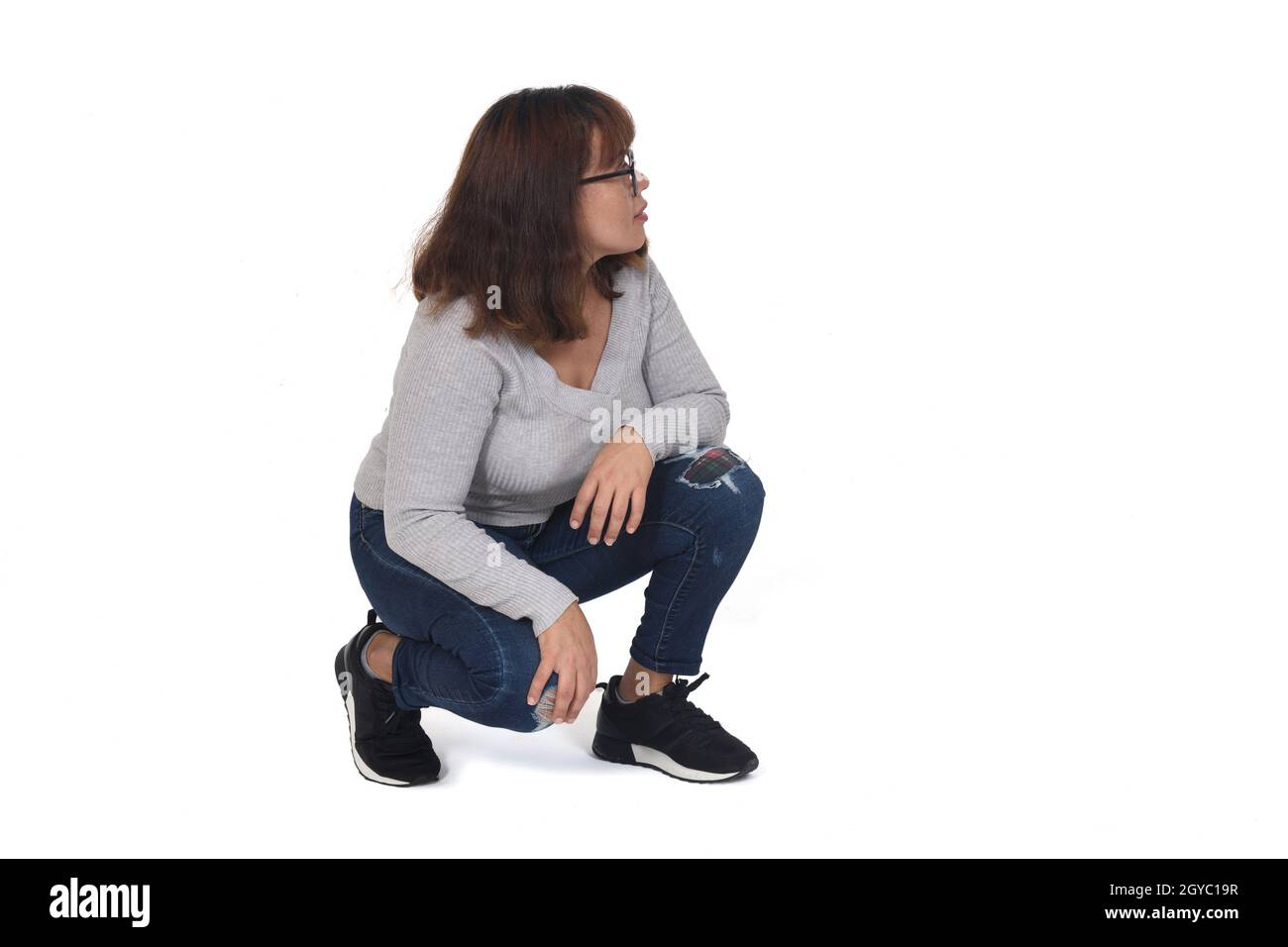 Squatting on the floor Cut Out Stock Images & Pictures - Alamy
